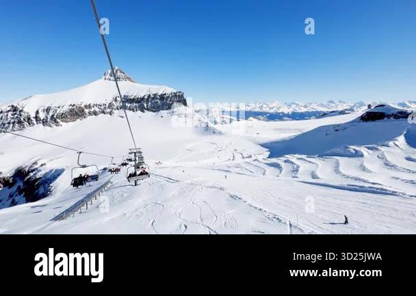 Glacier 3000, Switzerland - 15 February 2025: Scenic ski lift ride with ...