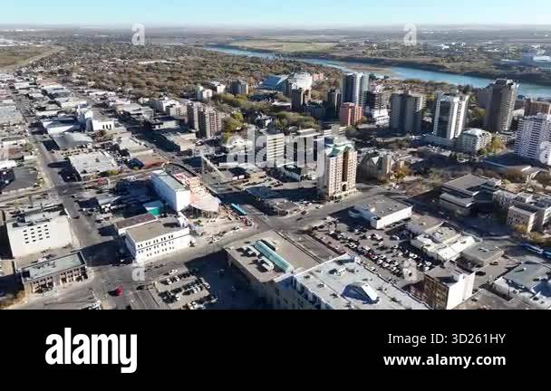 Aerial video of Downtown Saskatoon in fall showing colorful trees ...