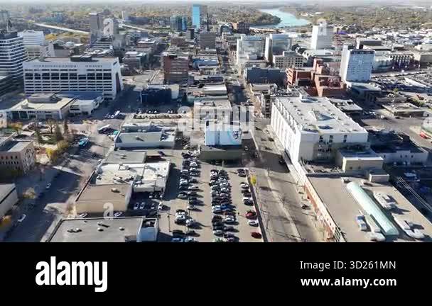 Aerial video of Downtown Saskatoon in fall showing colorful trees ...