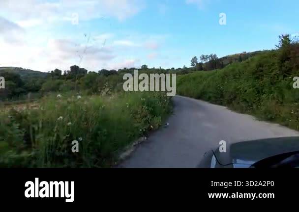 Point of view driving along Mediterranean roads in sunshine at sunset sunrise midday in ...