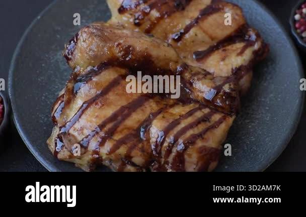 Grilled boneless chicken legs baked on the barbecue for lunch. Grilled ...