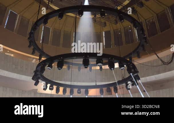 The stage lights are located on metal structures above the circular ...