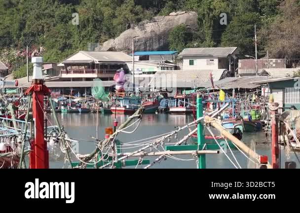 Fishermen and boats in a busy harbor scene Stock Video Footage - Alamy