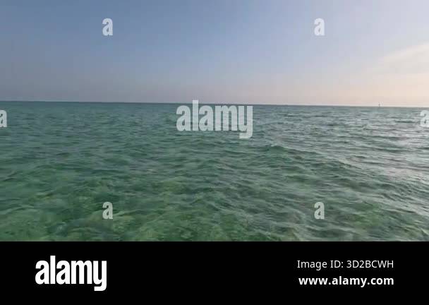 Serene ocean view with pier structure Stock Video Footage - Alamy