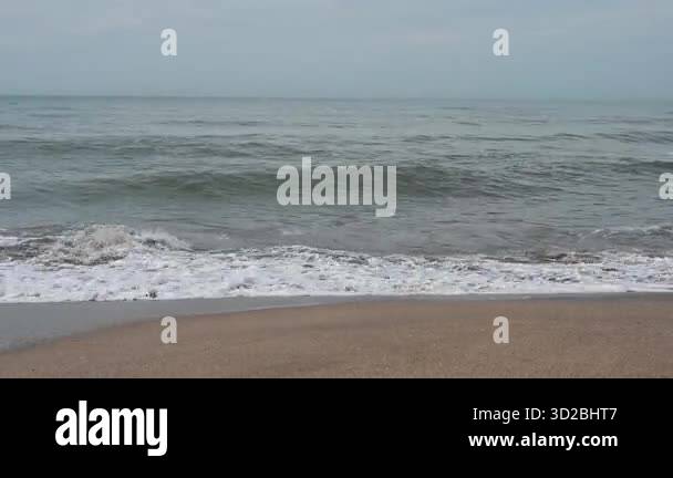 Windy seascape with ocean waves crashing on sandy beach Stock Video ...