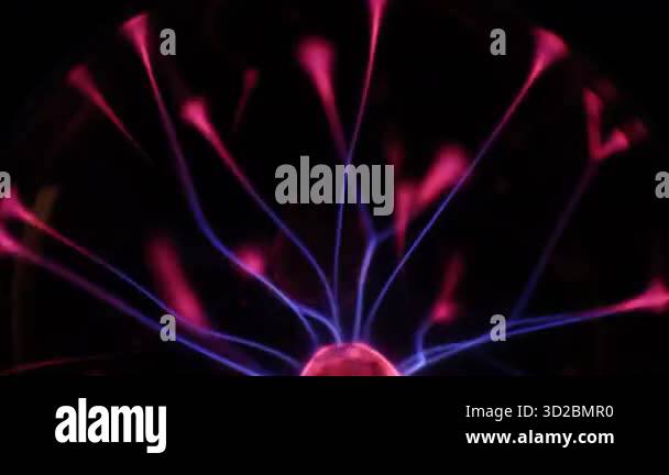 A stunning plasma globe radiates vibrant blue and pink electric arcs ...