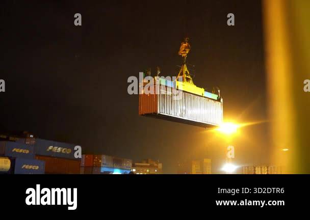 ALMATY, KAZAKHSTAN - SEPTEMBER 29 2025: Massive steel container sways ...
