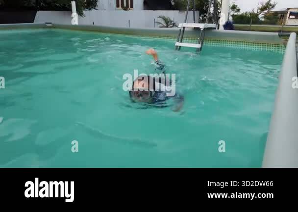 Happy little girl swimming in the pool Stock Video Footage - Alamy