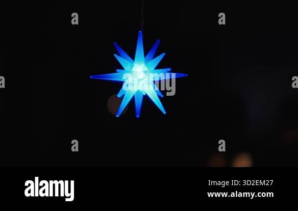 blue star decoration, elegant blue star decoration suspended on black ...
