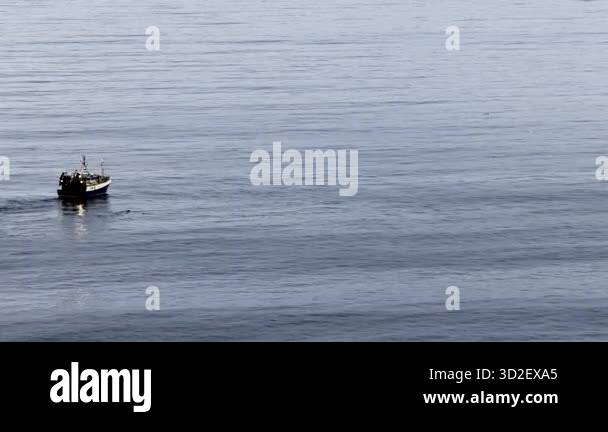 DONEGAL BAY, IRELAND - OCTOBER 11 2025 : Two trawler pulling one big ...
