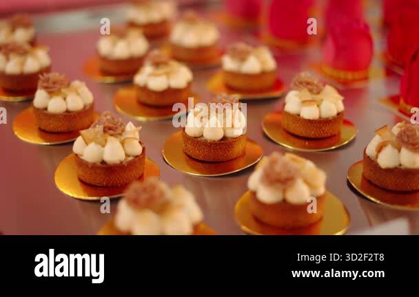 Mini tarts with cream and caramel decorations on tray, Elegant ...