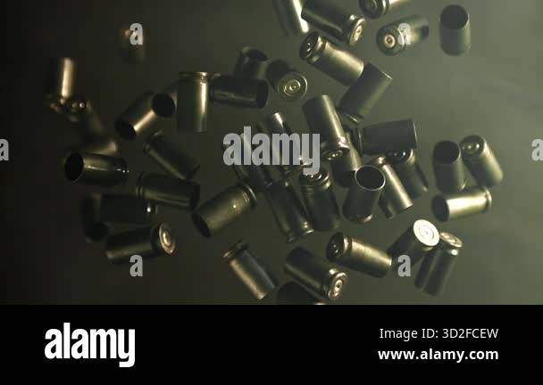 Bullet casings fly up and fall. Filmed on a high-speed camera at 1000 ...