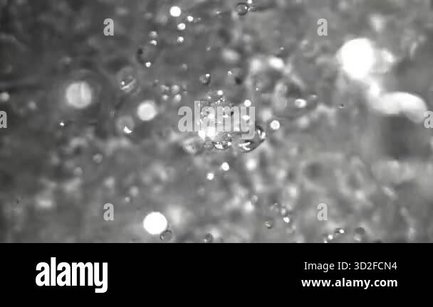 Water droplets fall down. Filmed on a high-speed camera at 1000 fps ...