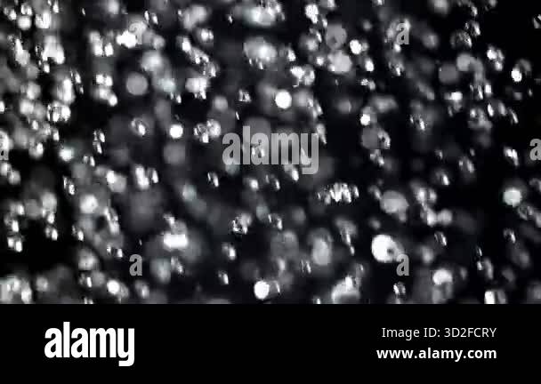 Raindrops fall down. Filmed on a high-speed camera at 1000 fps. High ...