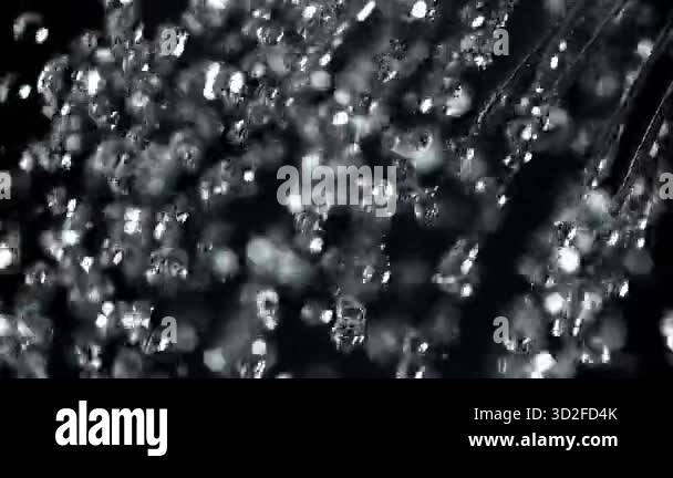 Raindrops fall down. Filmed on a high-speed camera at 1000 fps. High ...