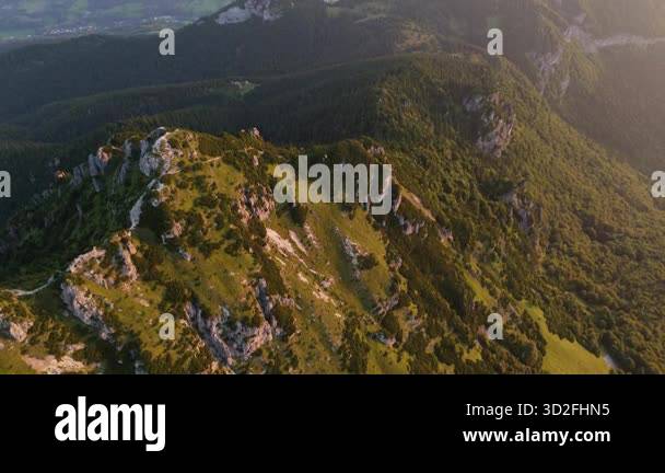 An aerial video features a smooth orbit camera movement, circling a ...