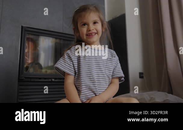A joyful child candidly showcases a variety of delightful expressions ...