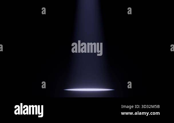 A single, powerful spotlight illuminates an empty stage, cutting ...