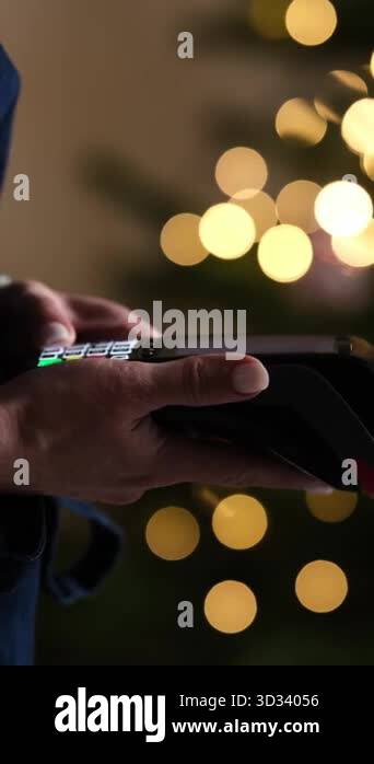 Waitress With Payment Terminal Printing Receipt Against Christmas ...