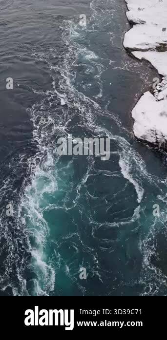 Waves of water of the river and the sea meet each other during high ...