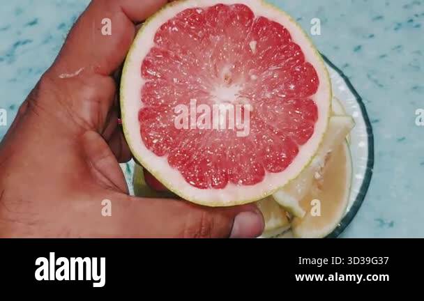 Close-Up Display of Ruby Red and Yellow Grapefruit Varieties Together ...
