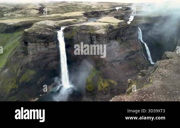 Witness the breathtaking beauty of Haifoss waterfall, cascading down ...