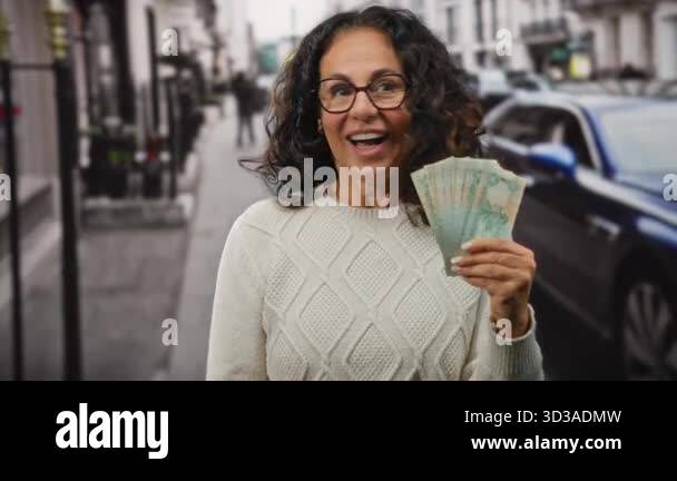 Woman excitedly holding uae Stock Videos & Footage - HD and 4K Video ...