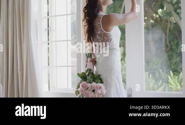 Bride and photographer entering suite showing DSLR images causing bride ...