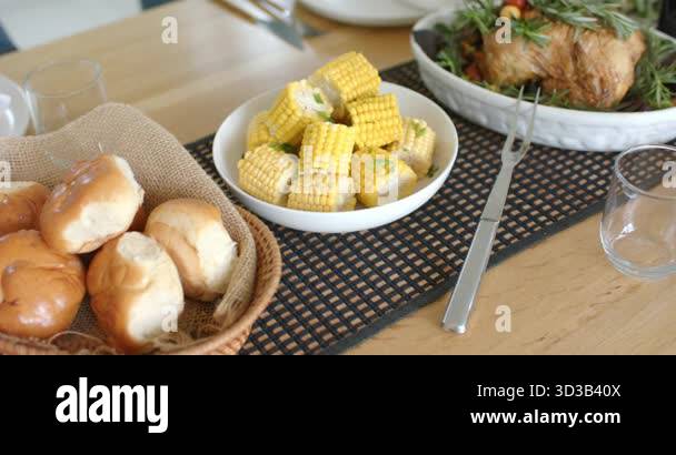 Camera is starting panning across dining table to reveal basket with ...