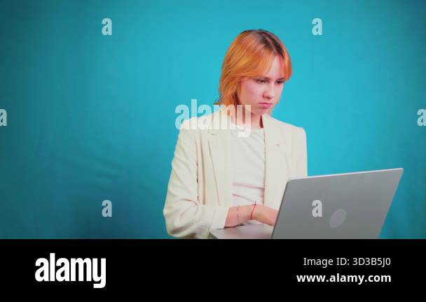 Annoyed young businesswoman feeling stressed while working on her ...