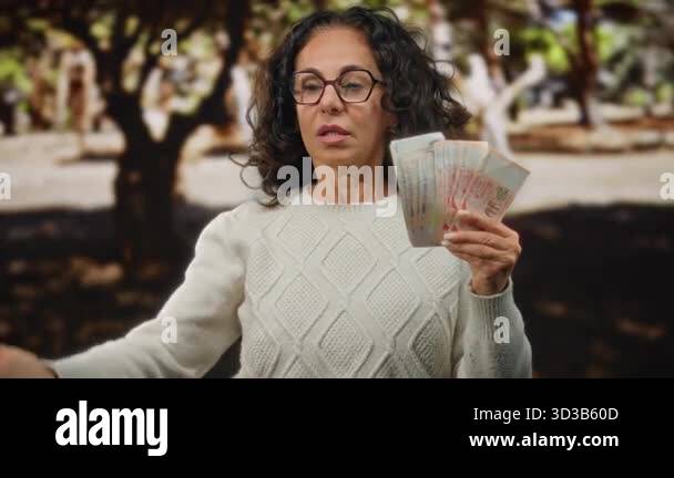 Woman in park counting singapore Stock Videos & Footage - HD and 4K ...