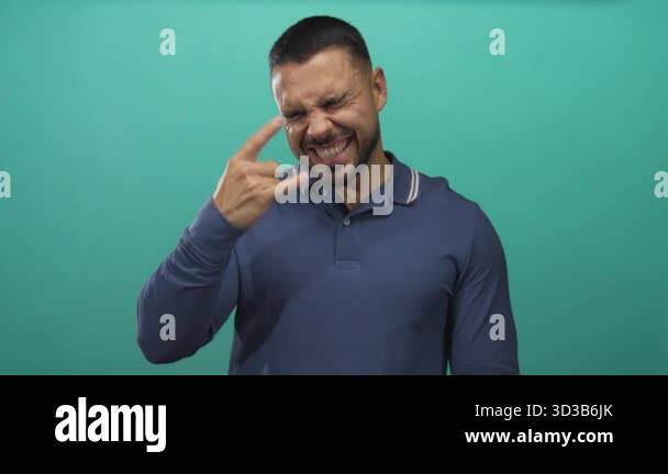 Man hand showing rock horns gesture and shouting with mouth open in ...