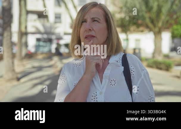 Woman touching chin gazing upward Stock Videos & Footage - HD and 4K ...