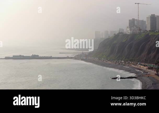 Aerial perspective of the Lima coastline with the district of ...