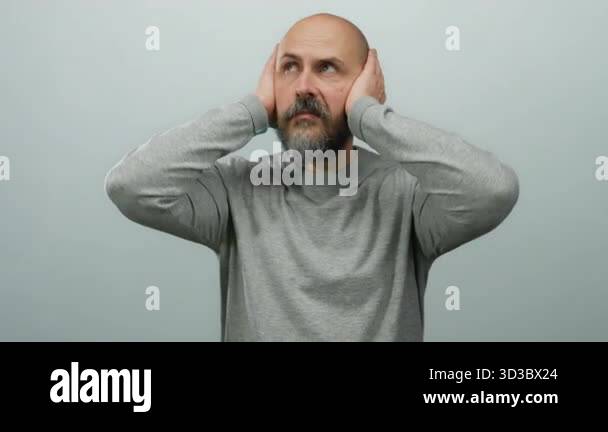 Bald man covering ears Stock Videos & Footage - HD and 4K Video Clips ...