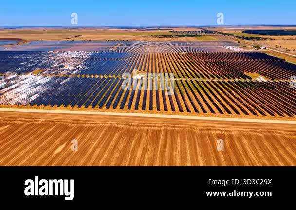 Mowed yellow fields with vast solar panels territories. Photovoltaic ...