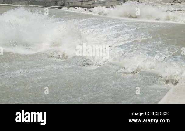 row of chute dentate blocks in concrete water spillway channel slope ...