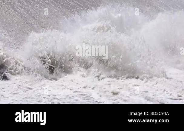 row of chute dentate blocks in concrete water spillway channel slope ...