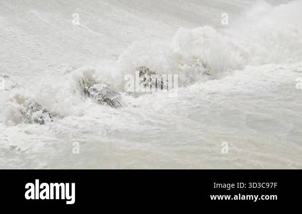 row of chute dentate blocks in concrete water spillway channel slope ...