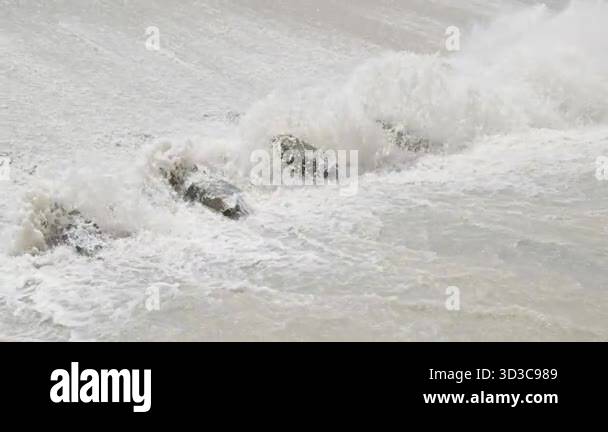 row of chute dentate blocks in concrete water spillway channel slope ...