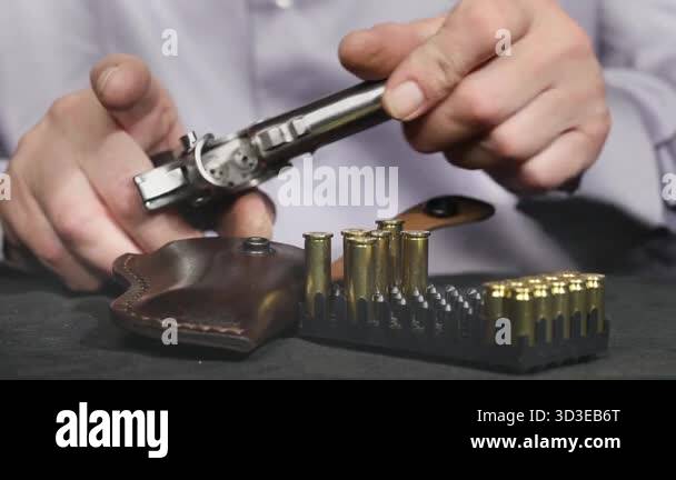 Loading of small personal two barrel derringer handgun of .38 special ...