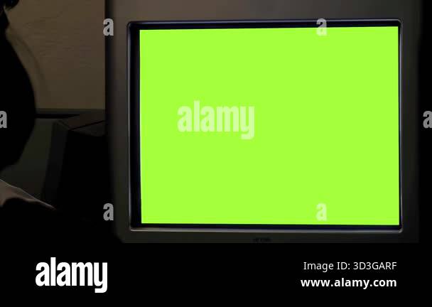 Silhouette of Child Using Green Screen Computer in Dim Classroom ...