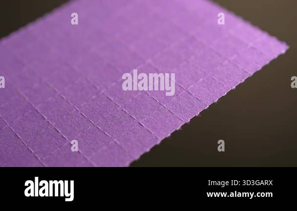 Person holding LSD strip blotters with dry drops of Lysergic acid drug ...