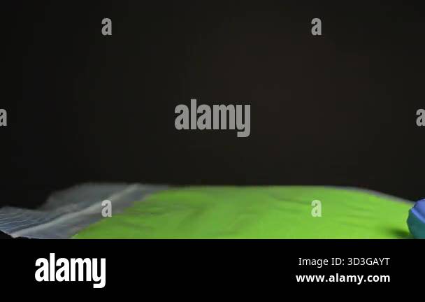 Police investigator in black gloves studying seized illegal LSD drugs ...