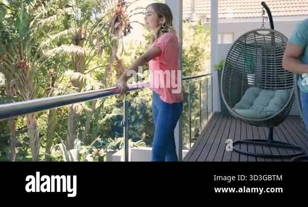 Proposal, Young couple enjoying sunny day on balcony, relaxing and ...