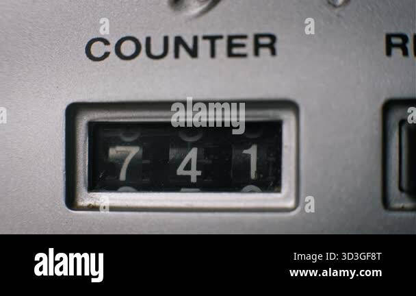 Extreme close-up of a mechanical counter on a silver vintage tape ...