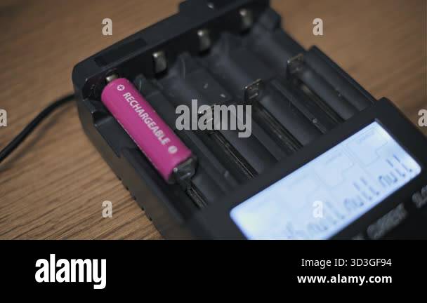 Close-up perspective of a hand carefully inserting four pink ...