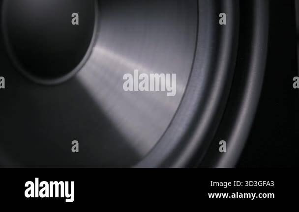 Extreme close-up pulsating black woofer cone membrane moving from ...