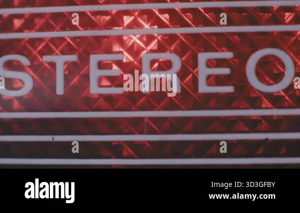 Macro shot vintage stereo indicator light turning on and off. Red lamp ...
