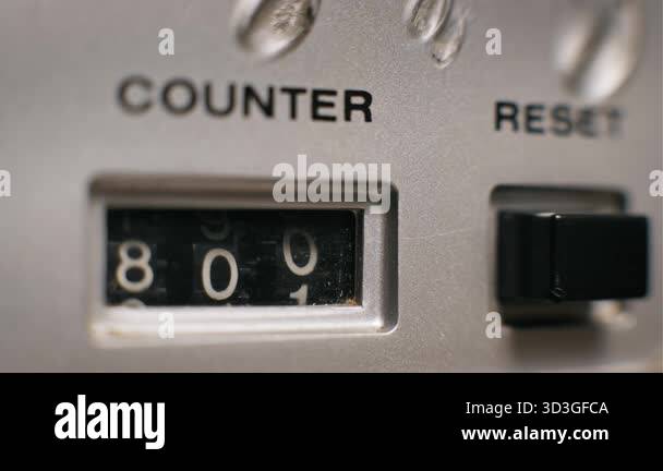 Close-up of a mechanical counter on a vintage device as the numbers ...